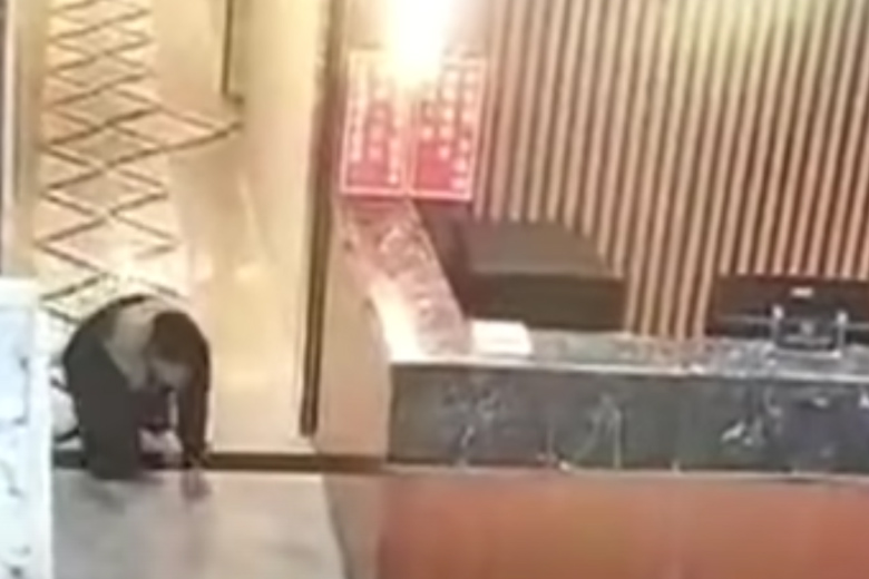 You won't believe why this man was crawling on the floor